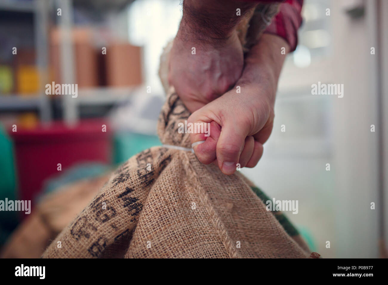 Man carrying heavy bags hi-res stock photography and images - Alamy