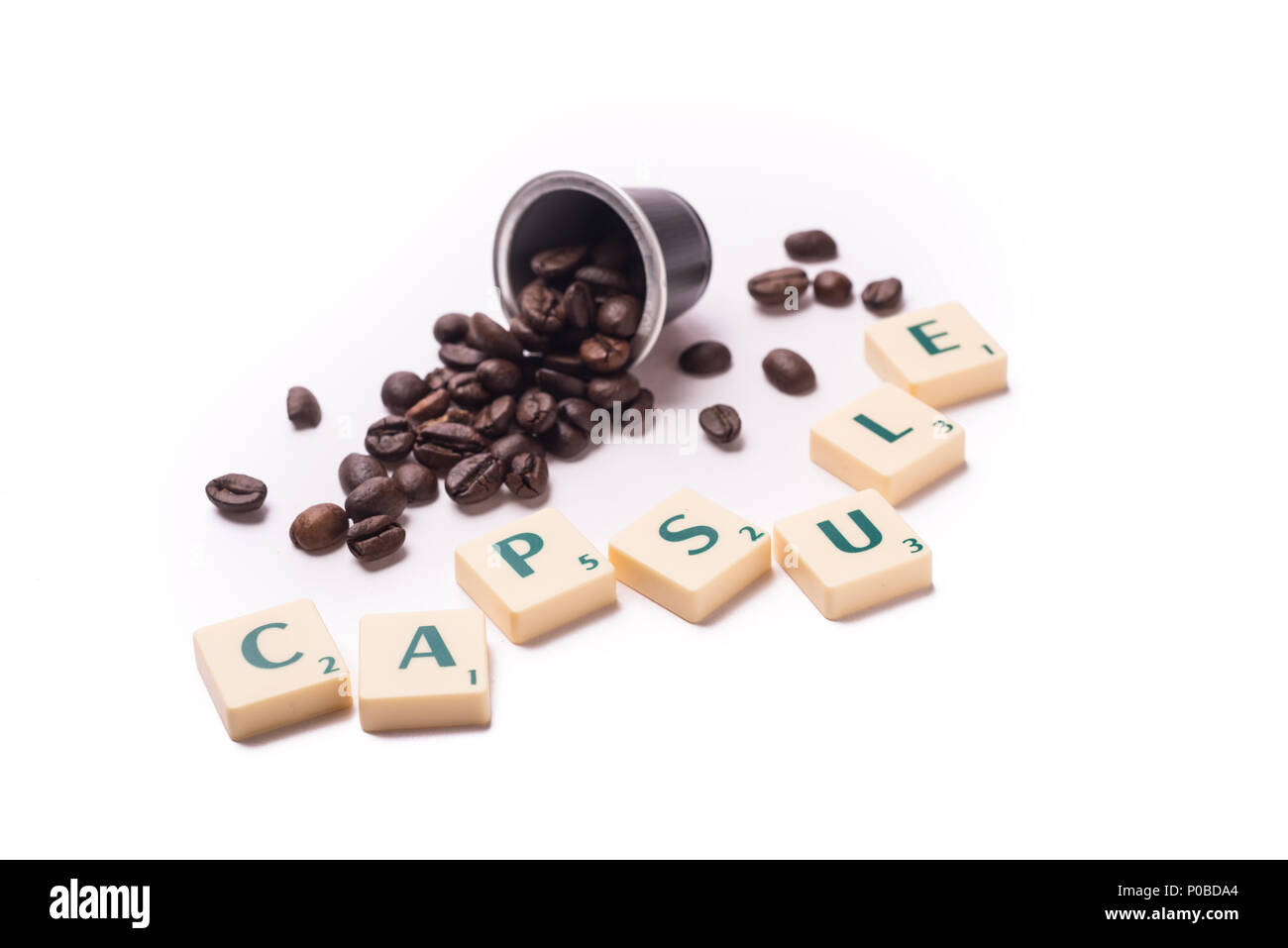 capsule written with scrabble letters on a white background composition ...