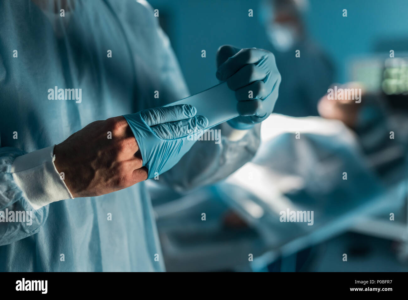 Senior woman taking off medical hi-res stock photography and images - Alamy