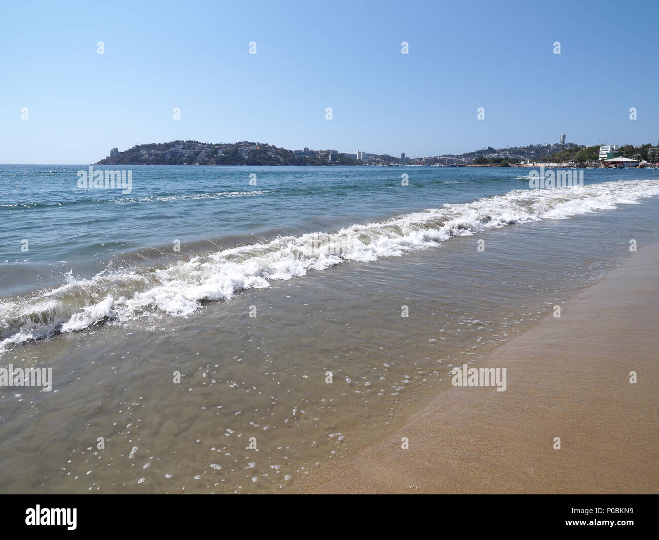 Pretty sandy beach at bay of ACAPULCO city in Mexico with luxury ...
