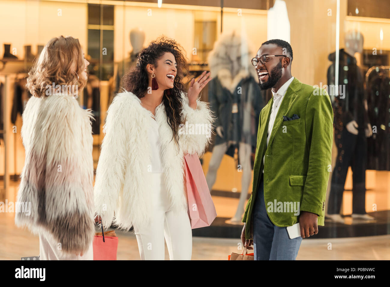 Male female talking shopping mall hi-res stock photography and images ...