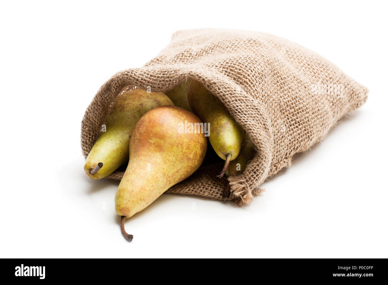 Ripe Conference pears in sakcloth bag isolated on white Stock Photo - Alamy