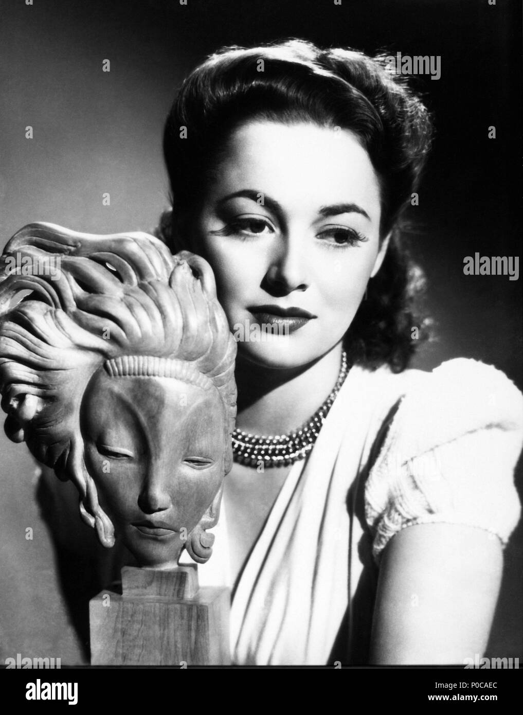 Year: 1941. Stars: OLIVIA DE HAVILLAND. Credit: SCHAFER, A.L. 'WHITEY ...