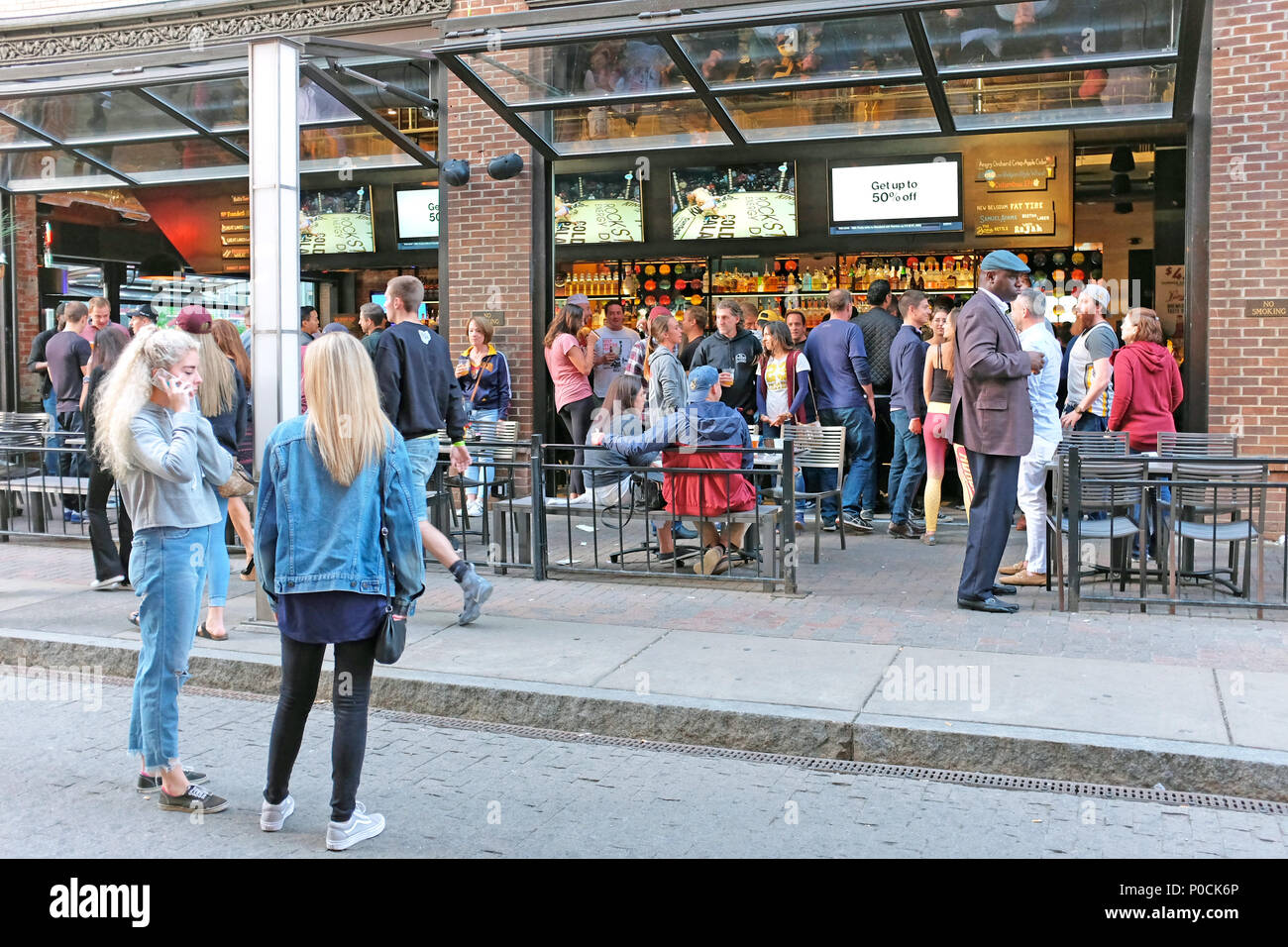 Two blond hair women outside bar hi-res stock photography and images ...