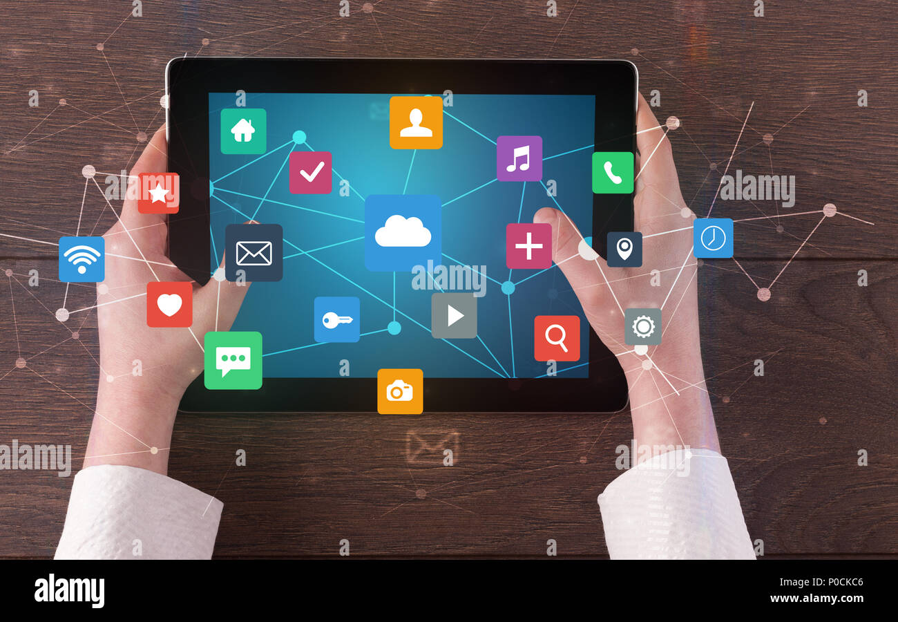 Hand touching multitask tablet with cloud wifi message social media ...