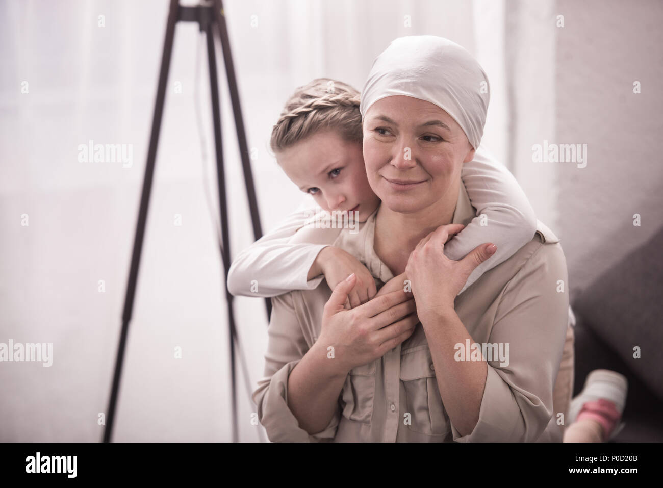 cute little child hugging sick grandmother in kerchief Stock Photo - Alamy