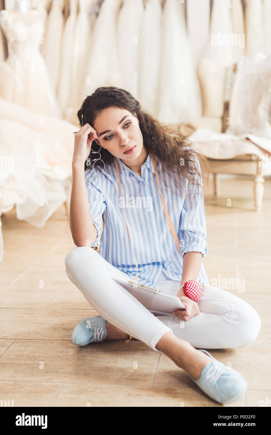 Tailor sitting hi-res stock photography and images - Alamy