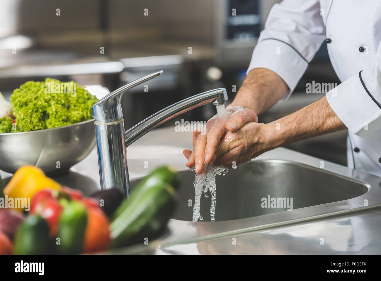 cropped image of chef washing hands at restaurant kitchen Stock Photo ...