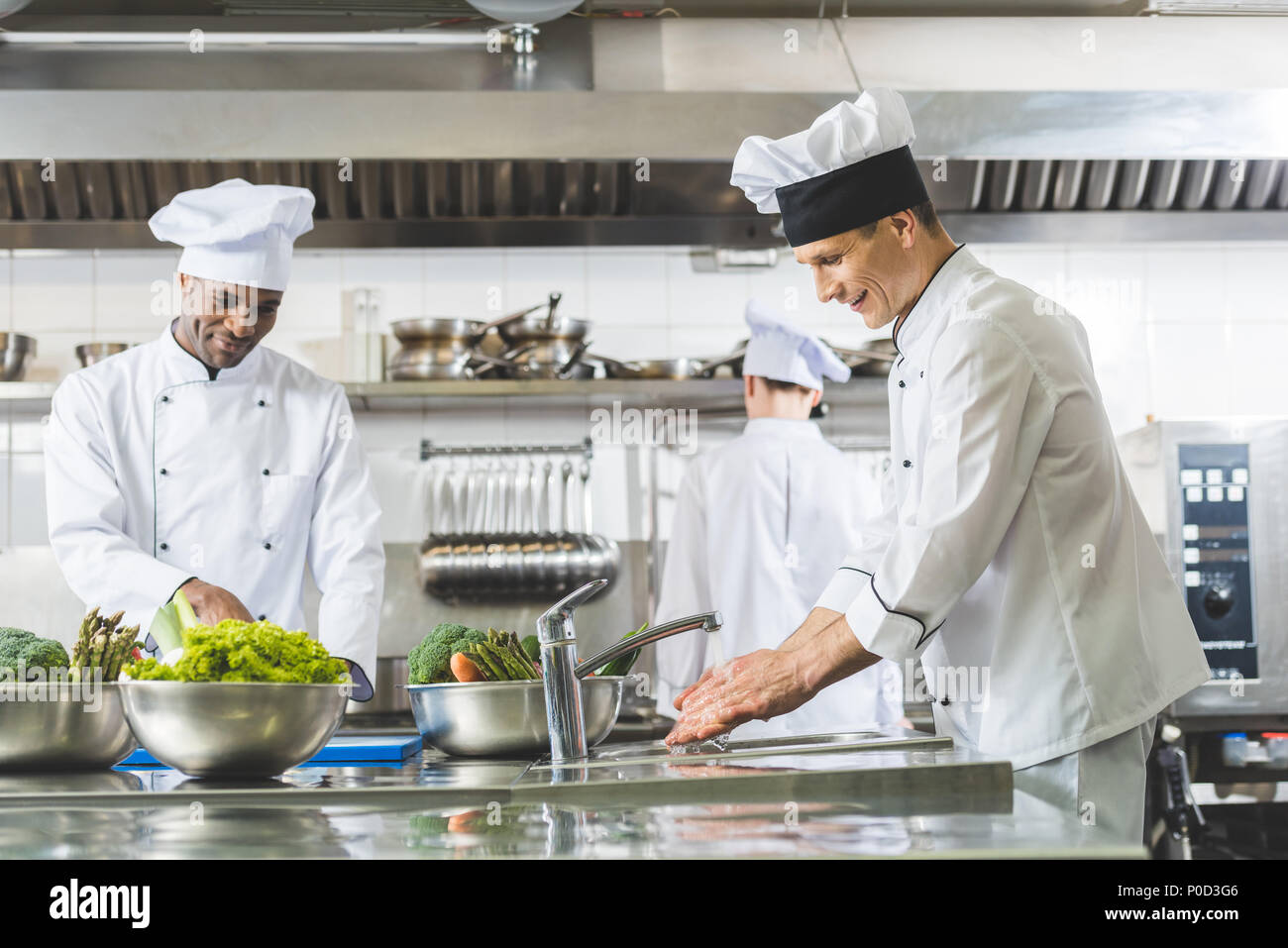 multicultural chefs working at restaurant kitchen Stock Photo - Alamy