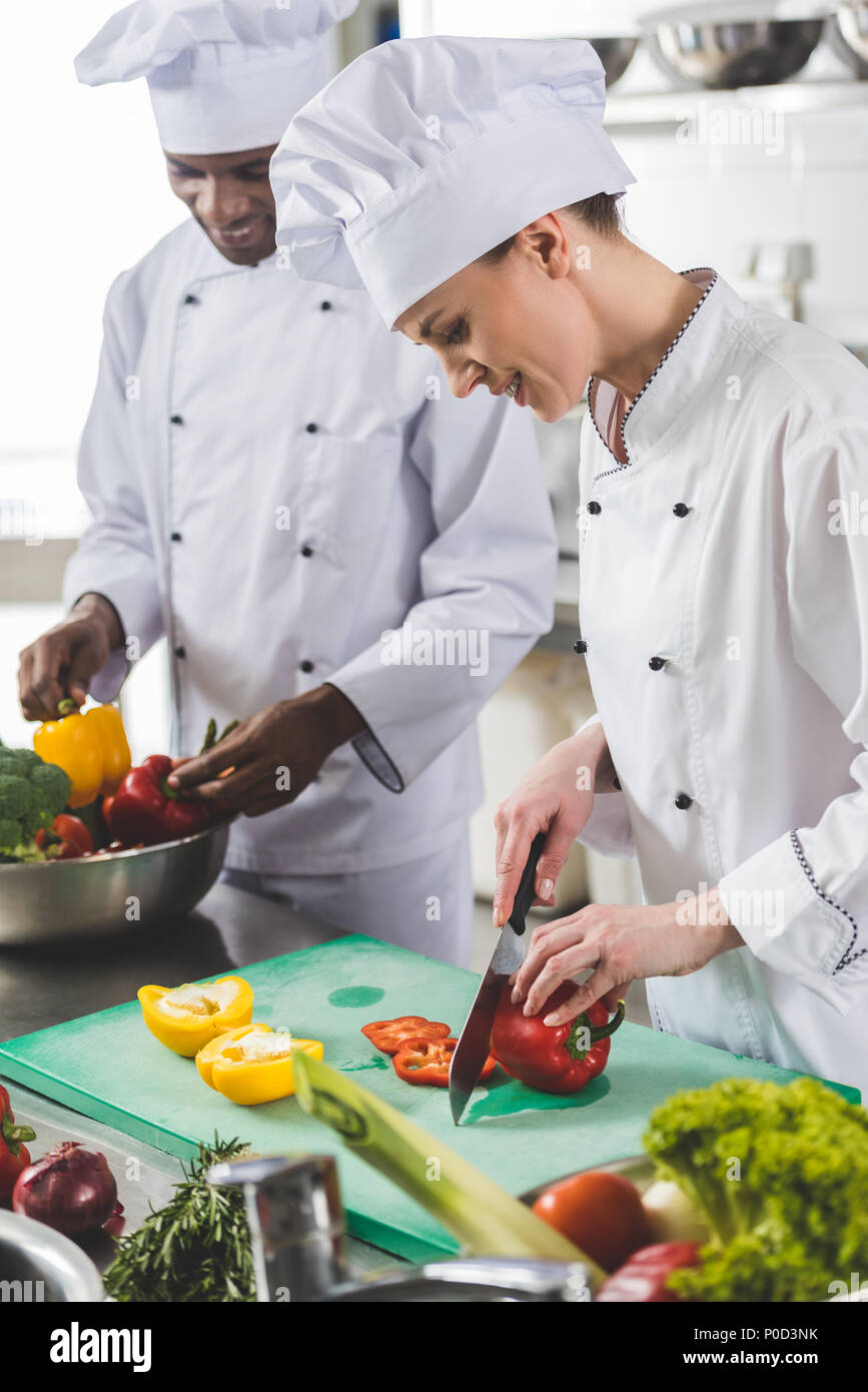 Woman chef cutting peppers hi-res stock photography and images - Alamy