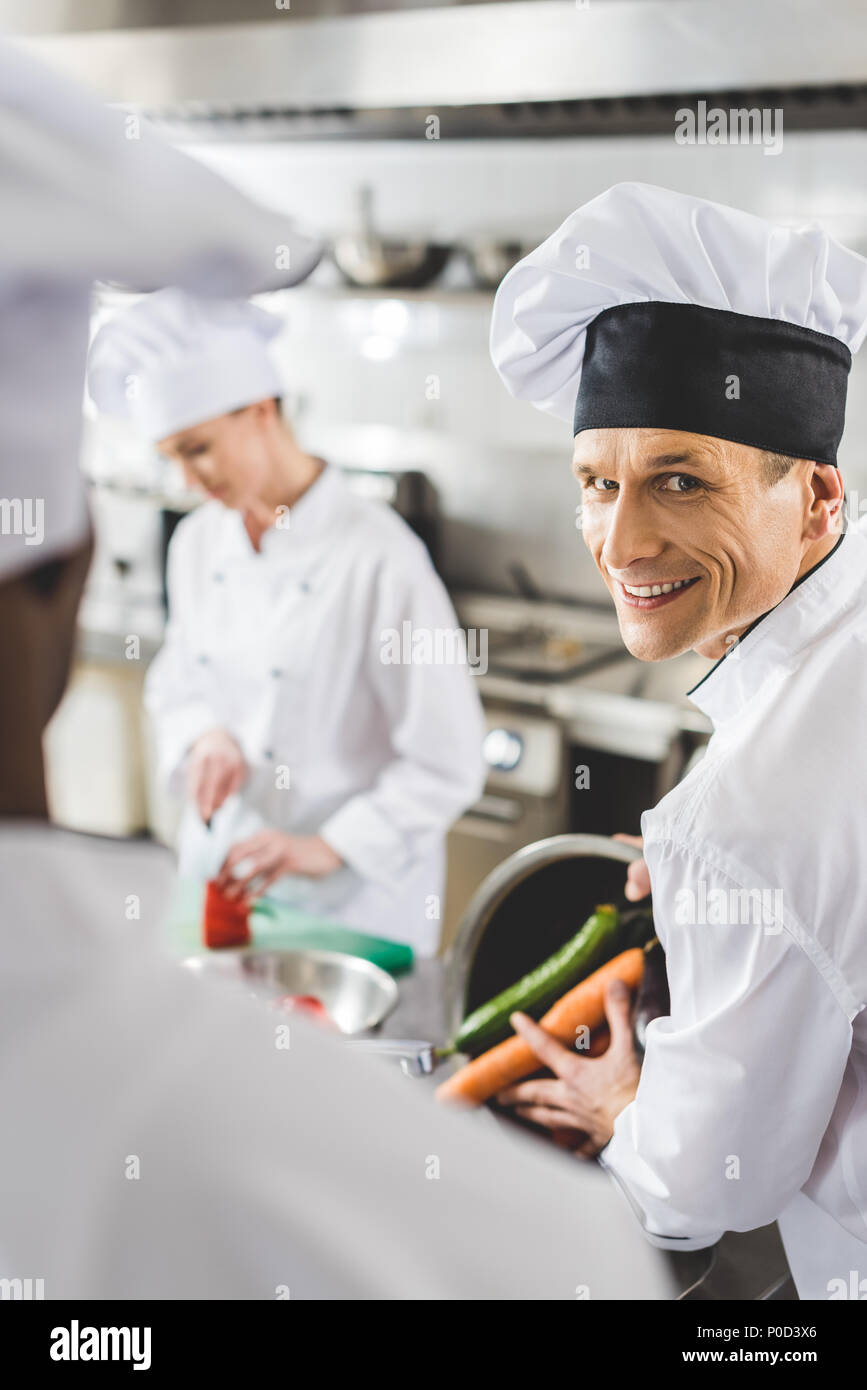 multicultural chefs cooking at restaurant kitchen Stock Photo - Alamy