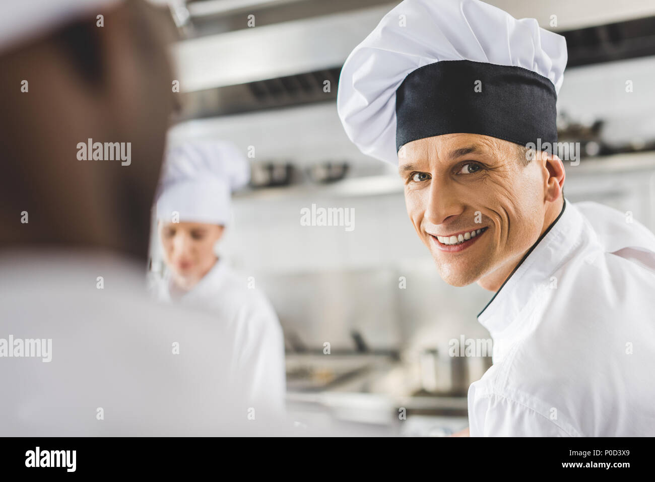 Smiling multicultural chefs restaurant hi-res stock photography and ...