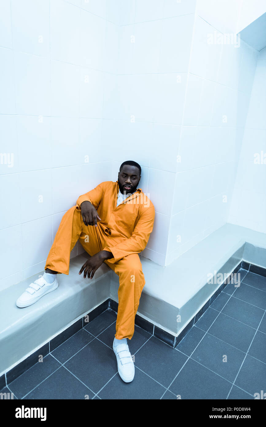 high angle view of african american prisoner sitting on bench Stock ...