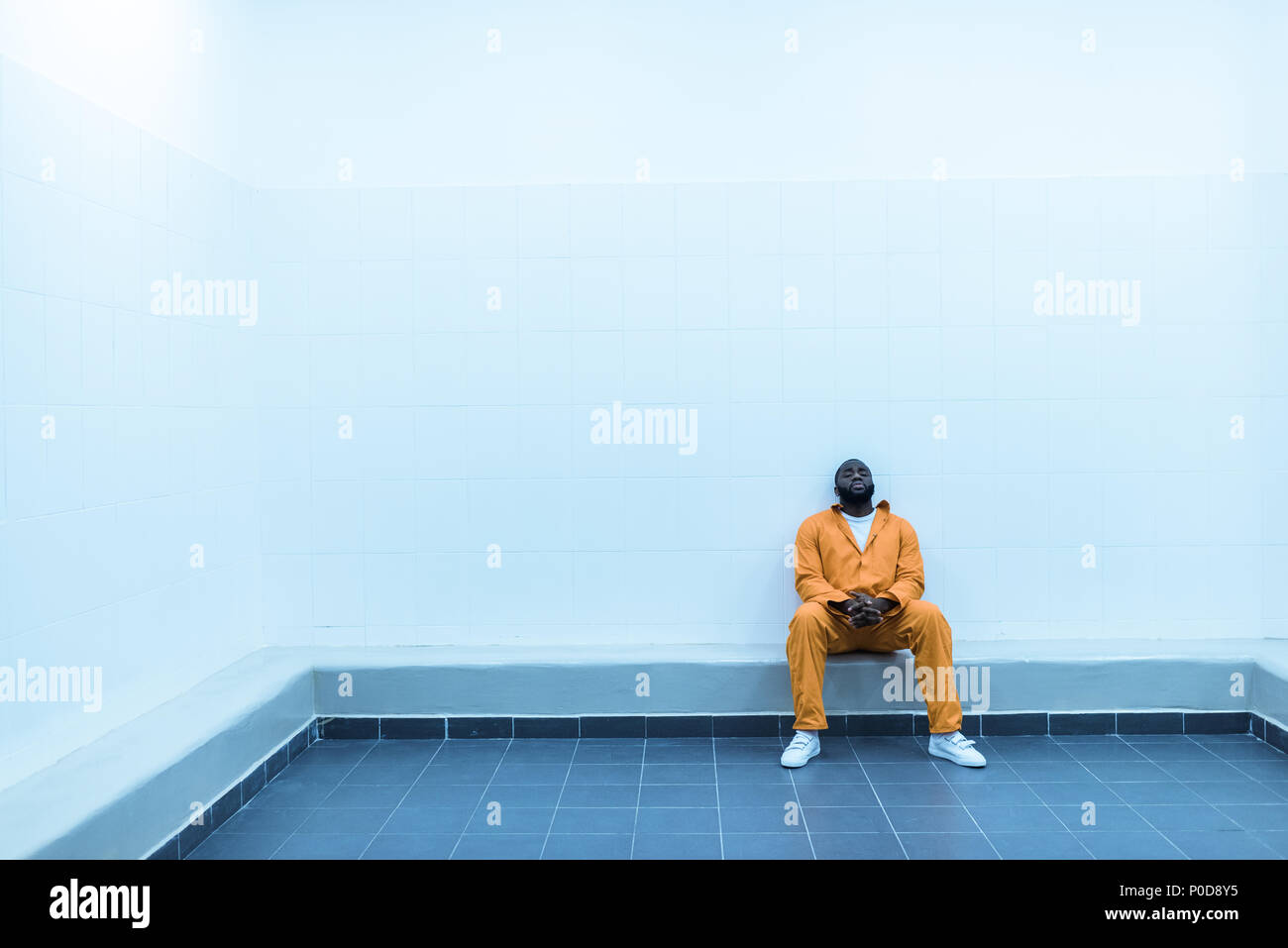 Prisoner sitting hi-res stock photography and images - Alamy