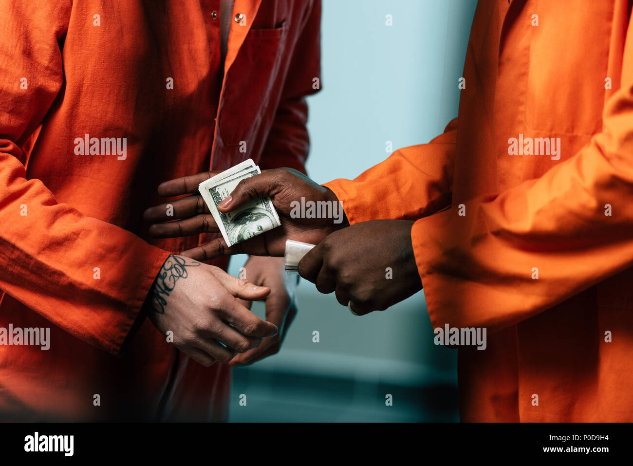 cropped image of prisoner buying drugs at african american inmate Stock ...