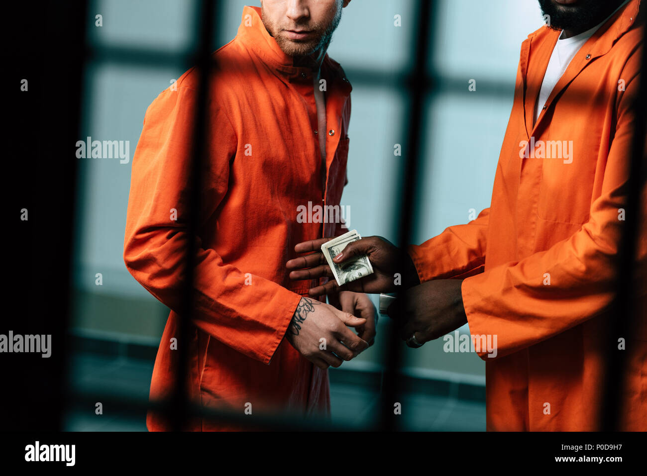 Prison cell bars prisoners hands hi-res stock photography and images ...