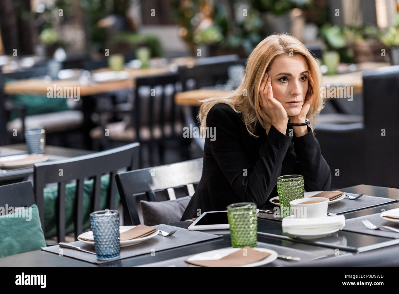 Waiting for someone at restaurant hi-res stock photography and images ...