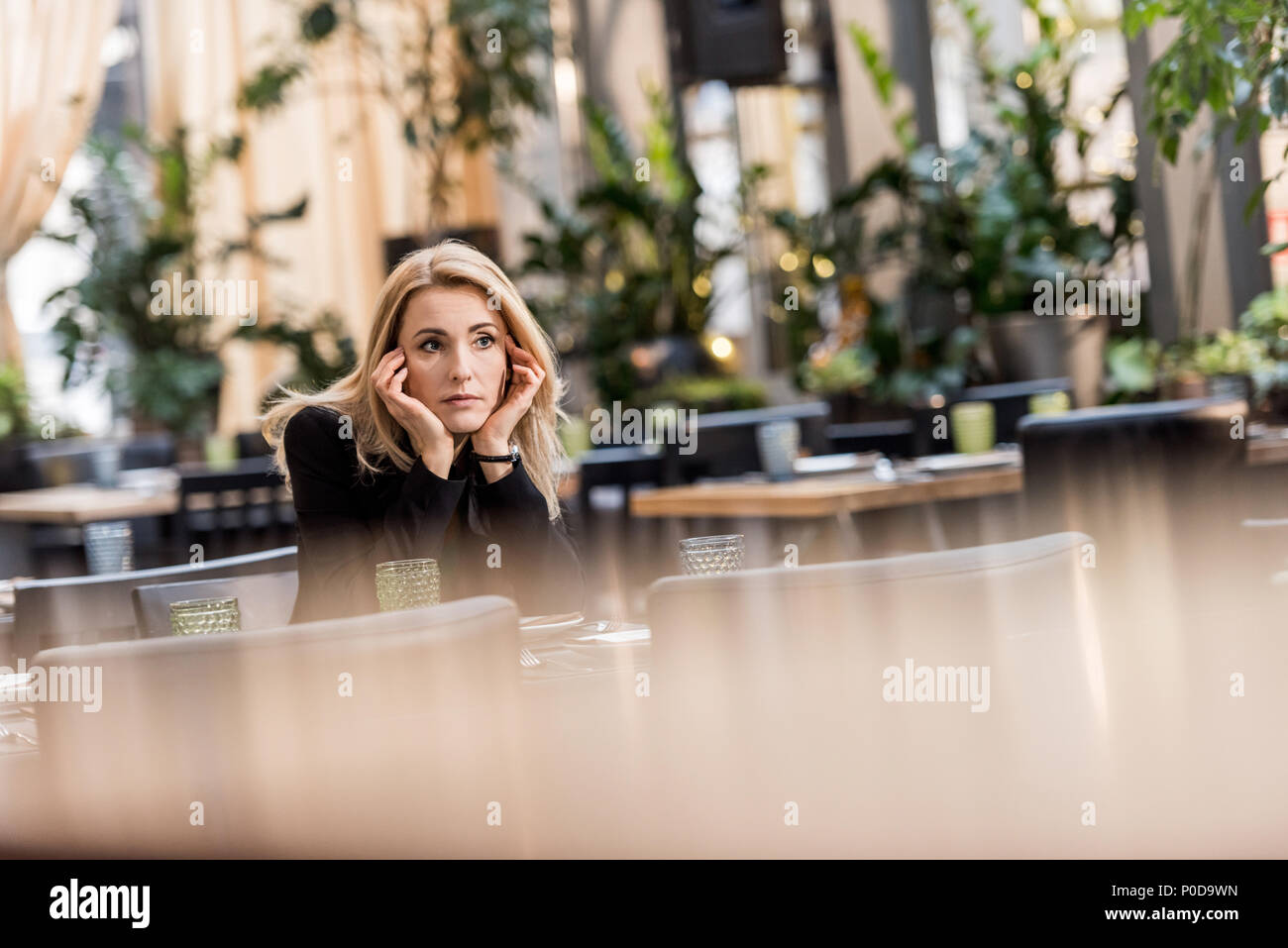 Waiting for someone at restaurant hi-res stock photography and images ...