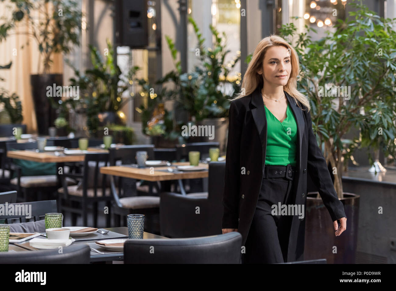 portrait of beautiful woman walking in restaurant Stock Photo - Alamy