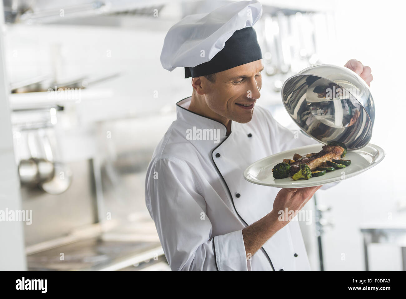 Handsome chef looking meal hi-res stock photography and images - Alamy