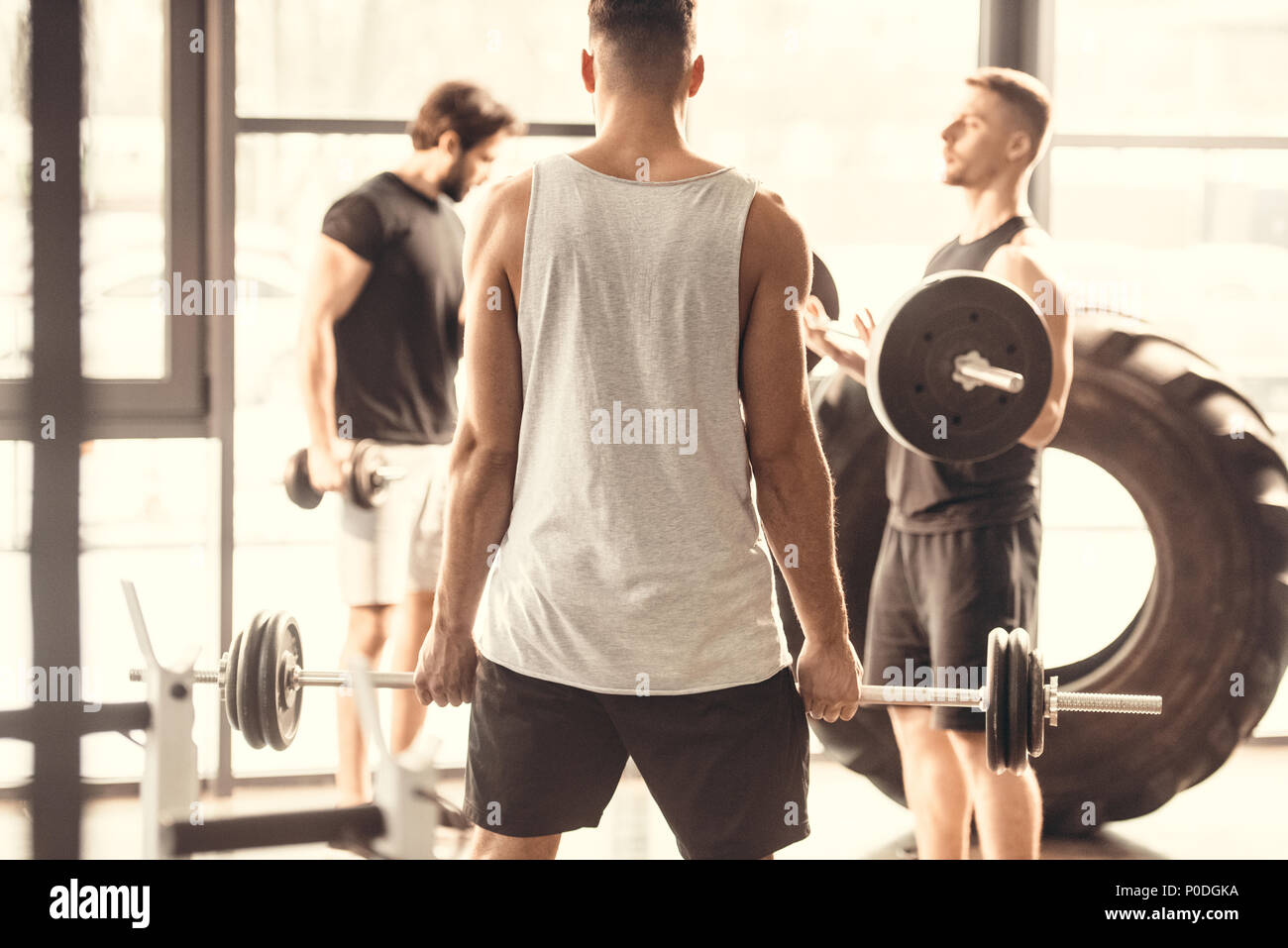 Dumbbell man back view hi-res stock photography and images - Alamy