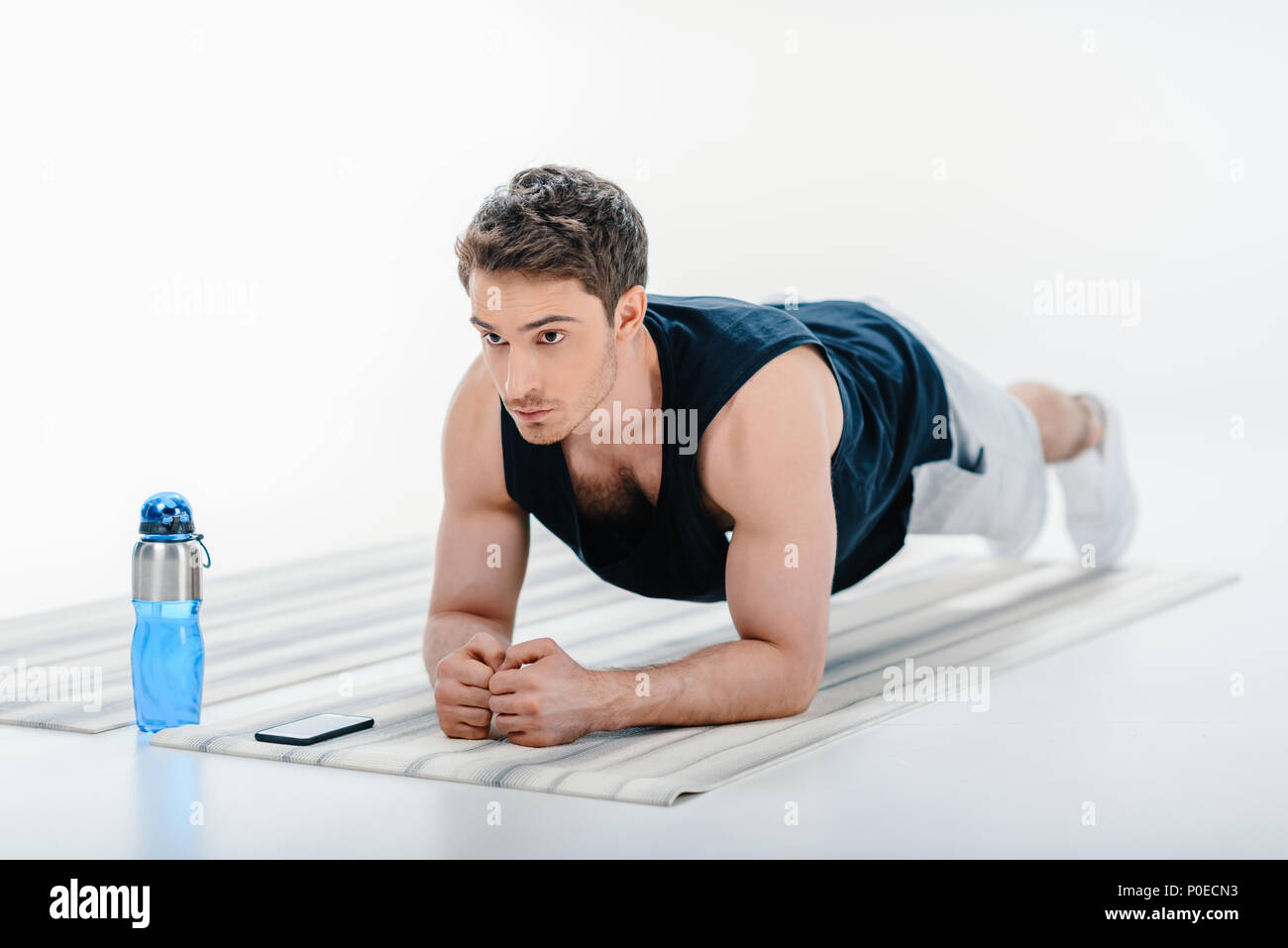 handsome man standing plank isolated on white Stock Photo - Alamy