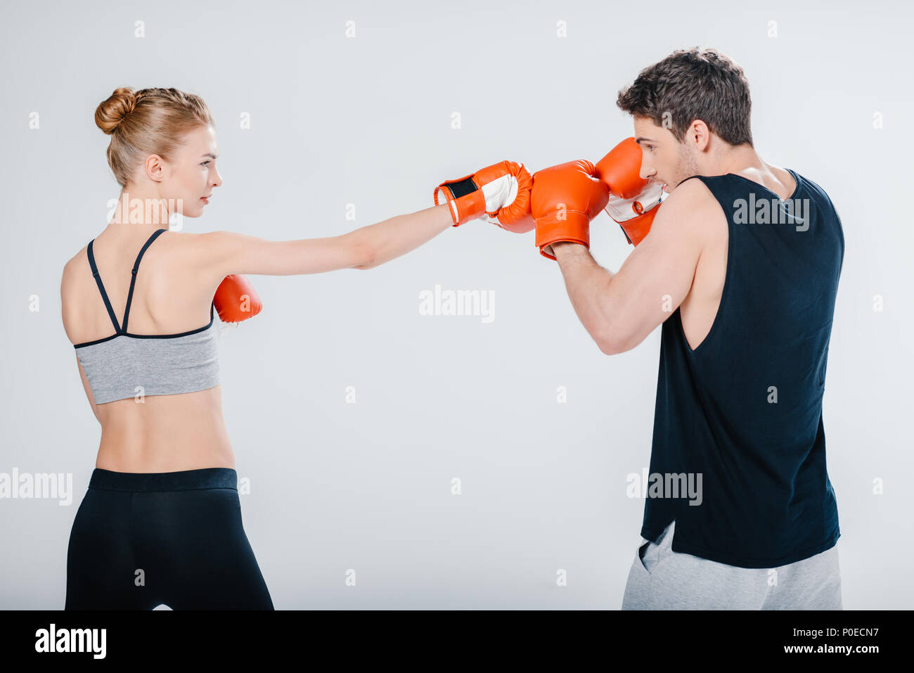 young couple boxing isolated on white Stock Photo - Alamy