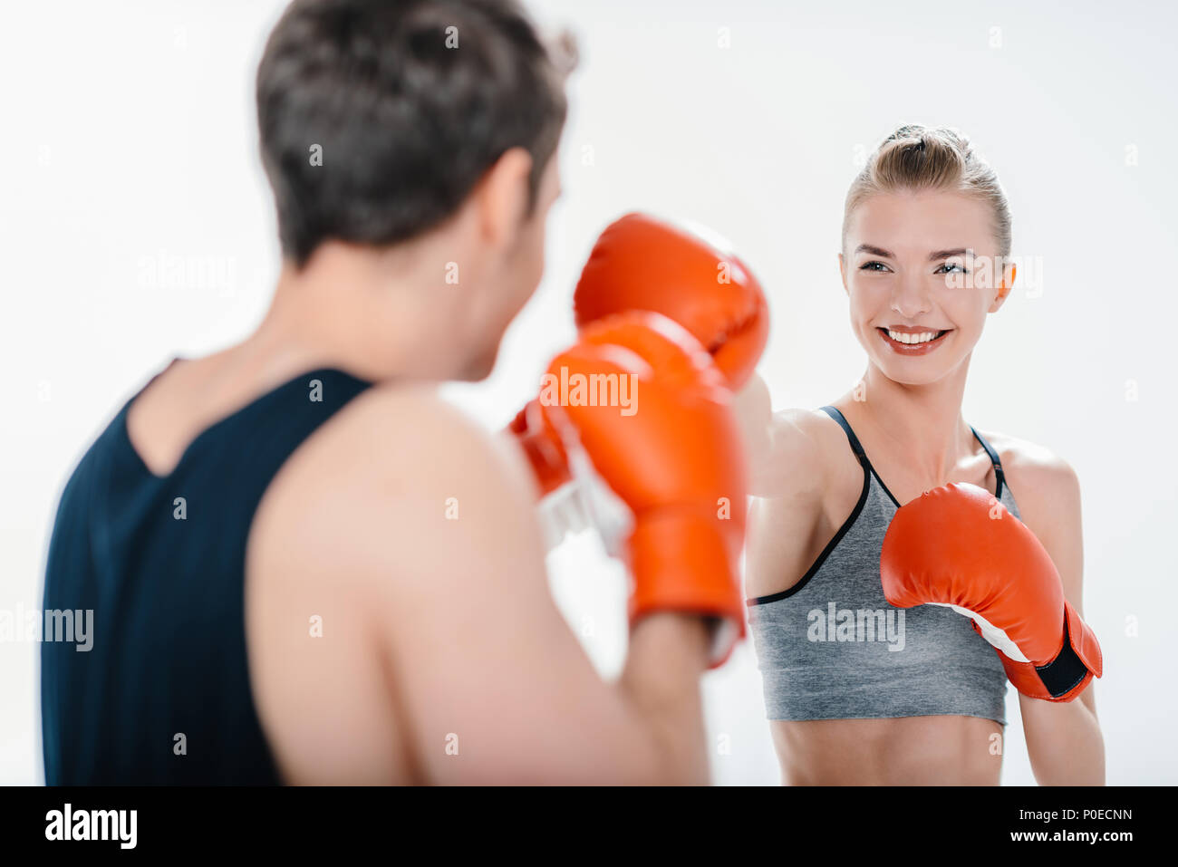 beautiful young girl boxing with trainer isolated on white Stock Photo ...