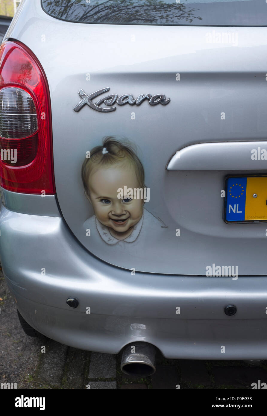Car with Gaudy Children Stickers in Amsterdam Stock Photo - Alamy