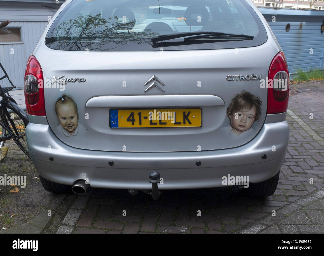 Car with Gaudy Children Stickers in Amsterdam Stock Photo - Alamy