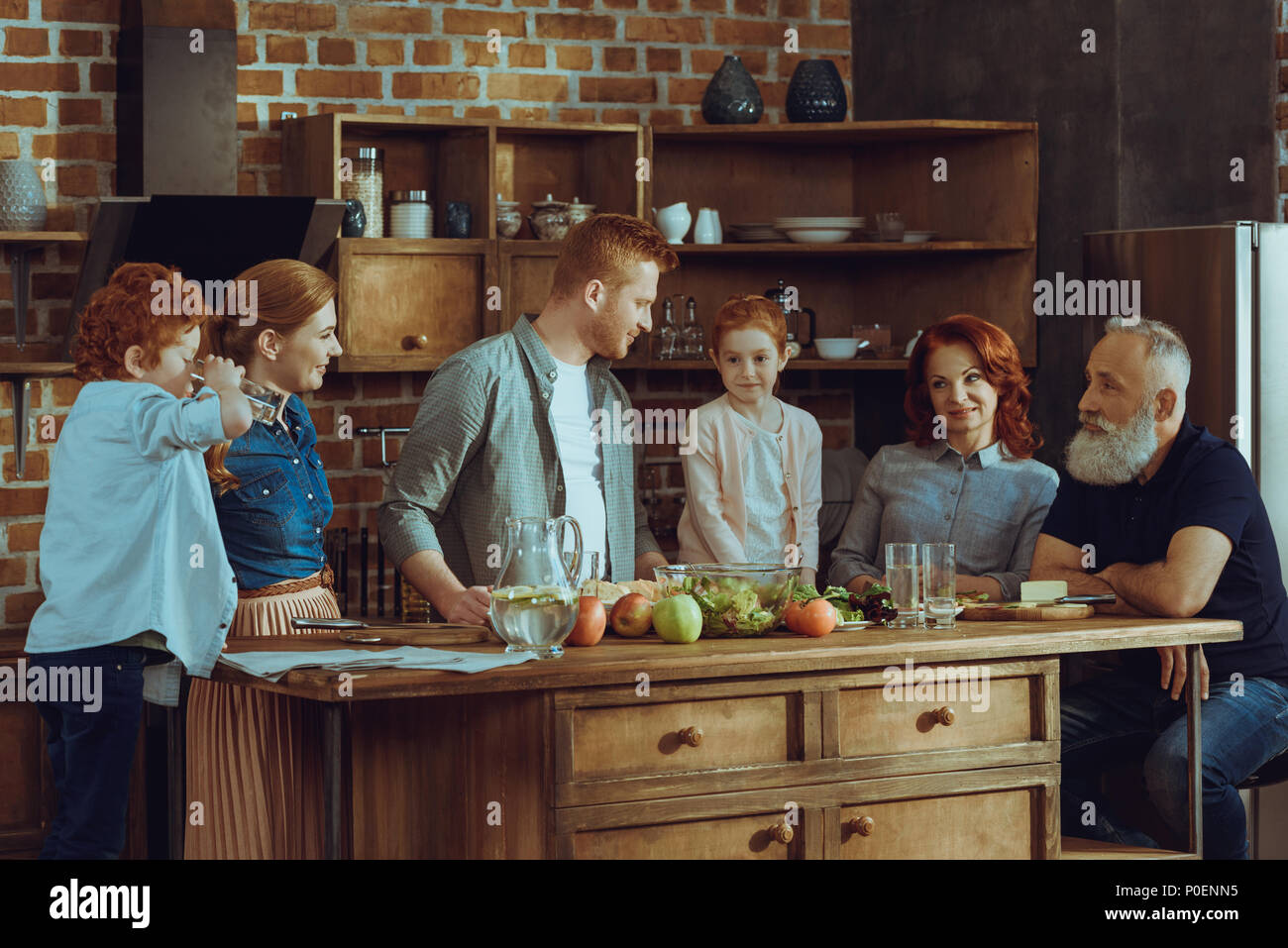 Parents and kids cooking in kitchen hi-res stock photography and images ...
