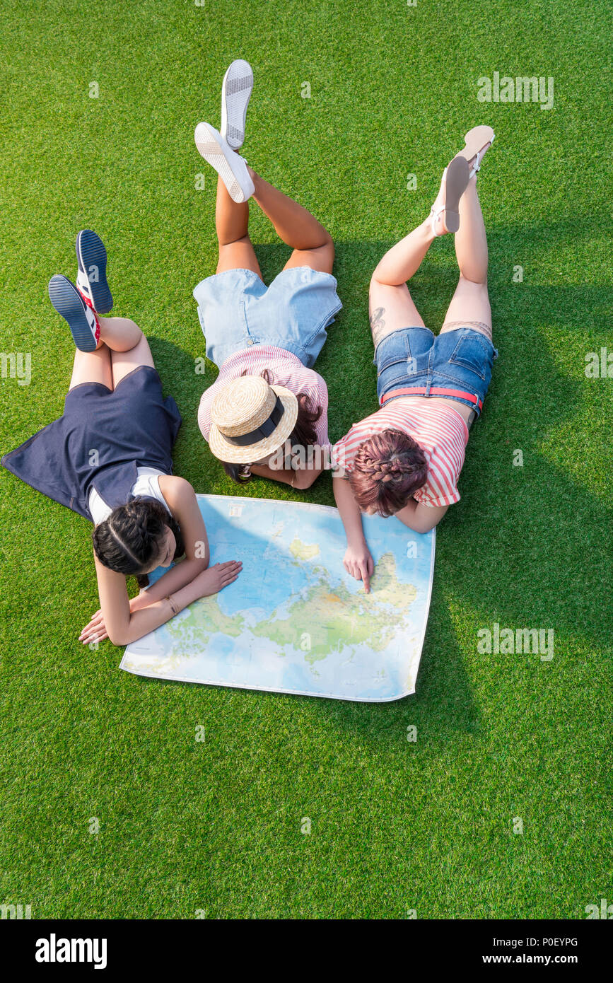 Woman lying with map hi-res stock photography and images - Alamy