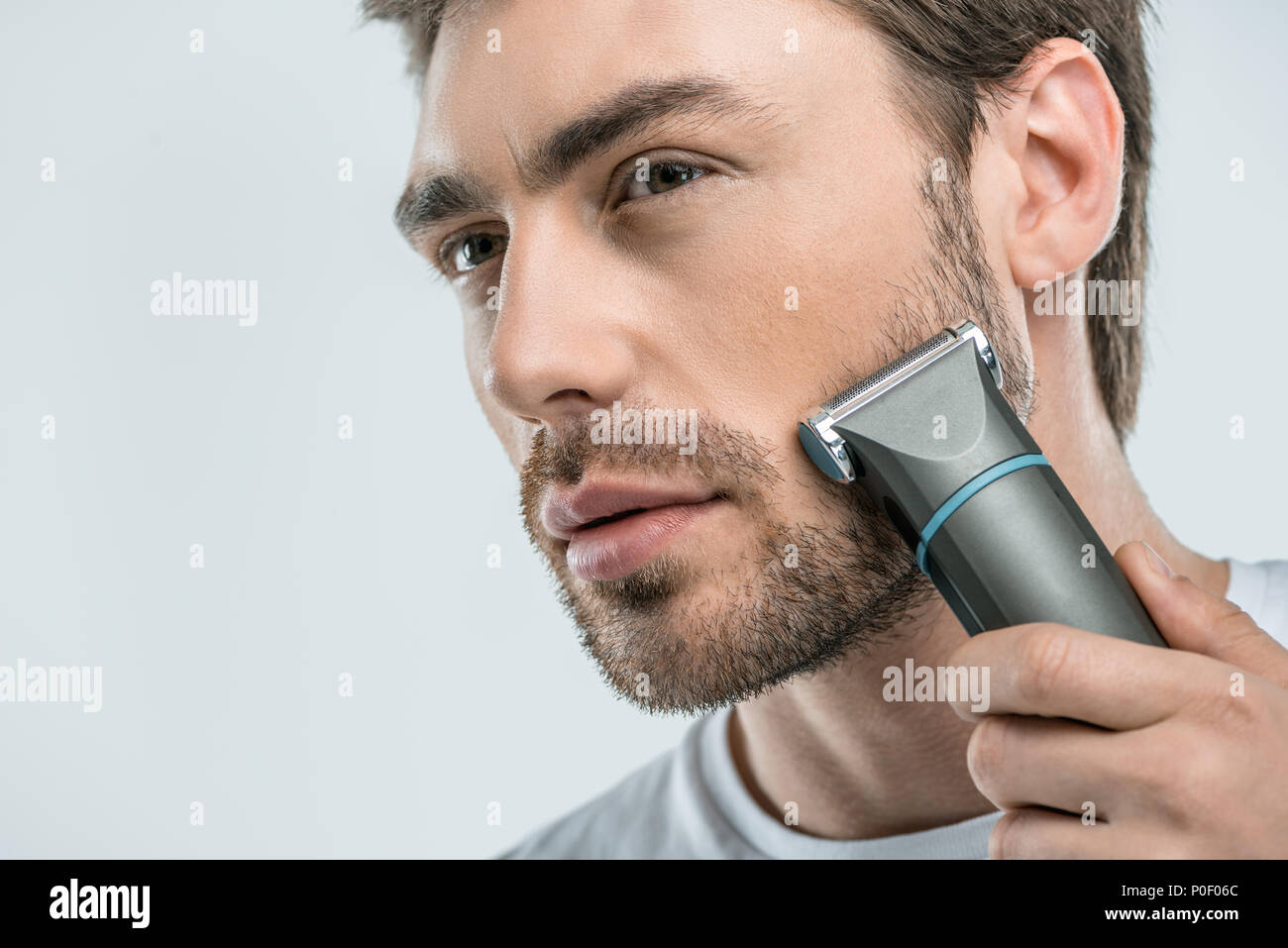 Man shaving using electric razor hi-res stock photography and images ...