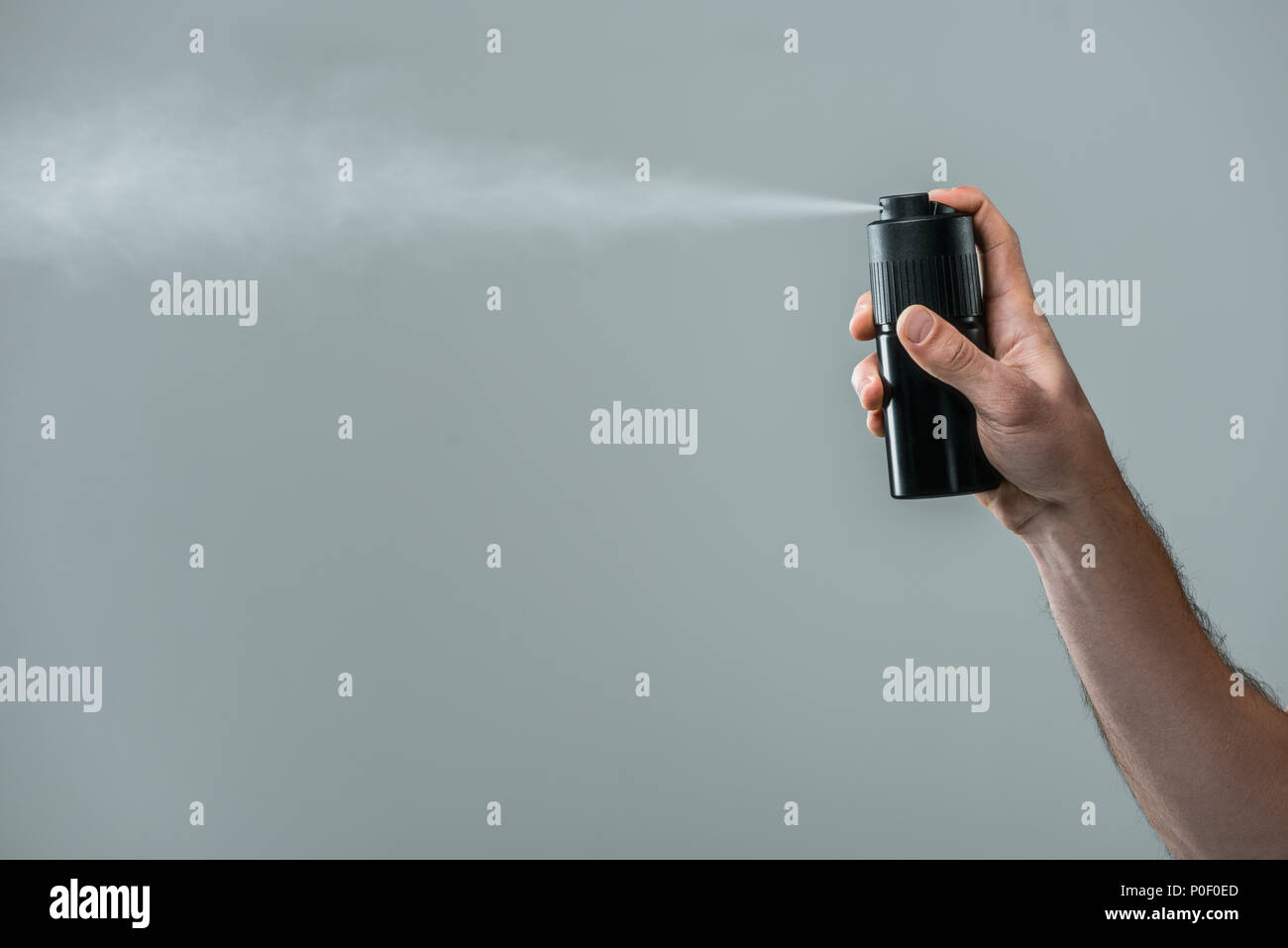 Cropped view man spraying hi-res stock photography and images - Alamy