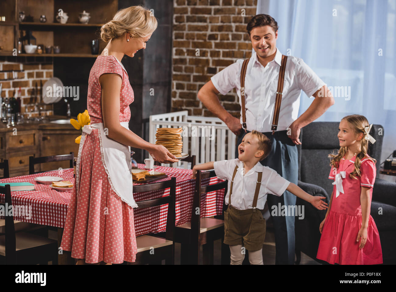 1950s style family having delicious pancakes for breakfast Stock Photo ...
