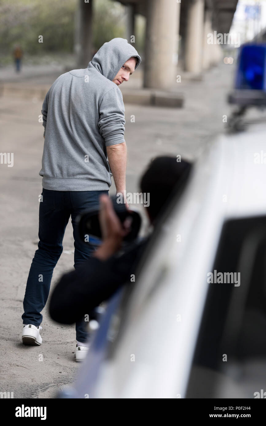 Walking looking away police officer on duty uniform hi-res stock ...