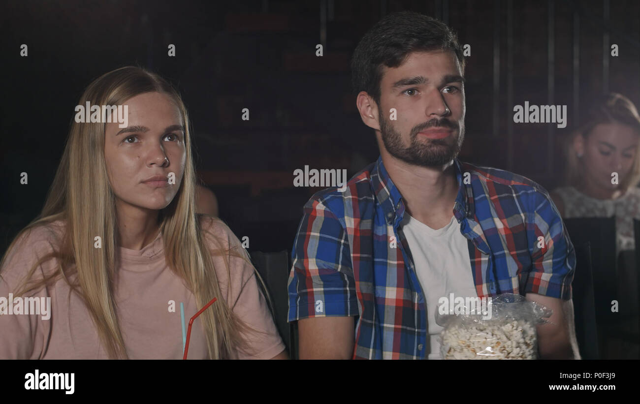 Young people watch movies carefully in cinema Stock Photo - Alamy