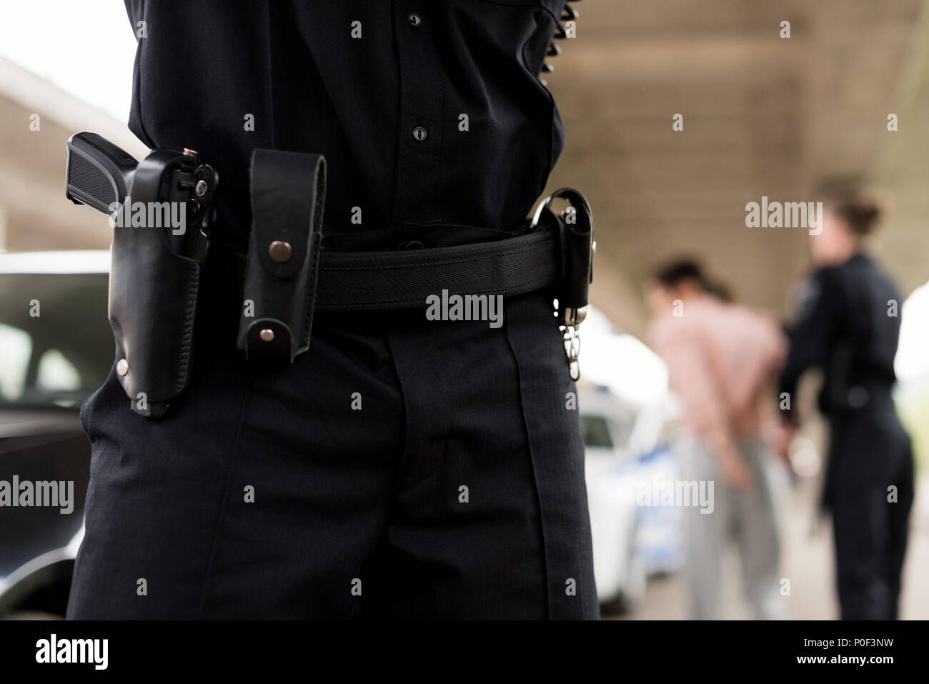 Police officer gun belt handcuffs hi-res stock photography and images ...