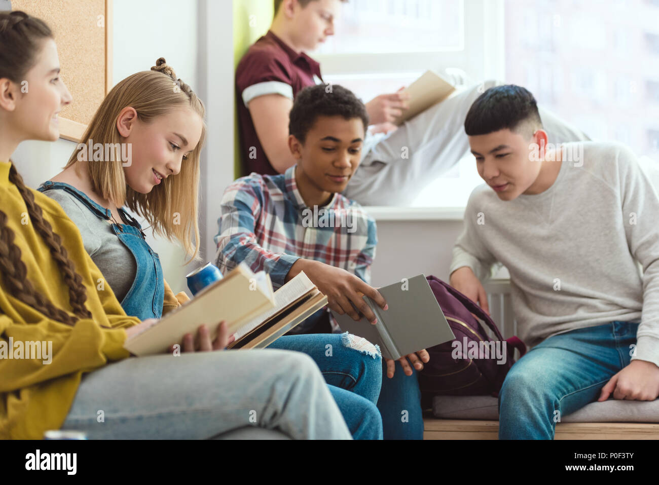 Group of multicultural high school teenage high school students doing ...