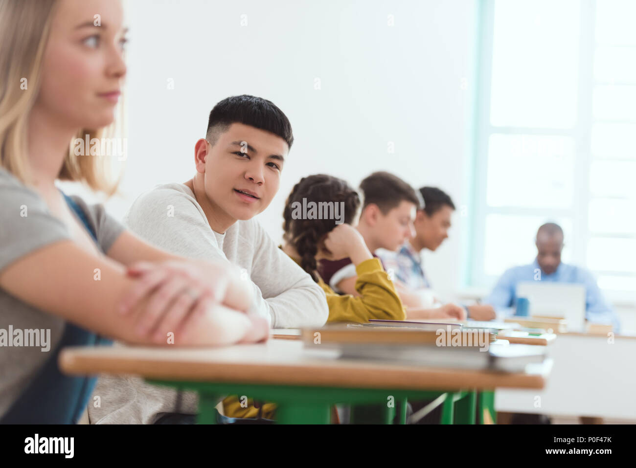 Portrait of high school teenage asian student with classmates and ...