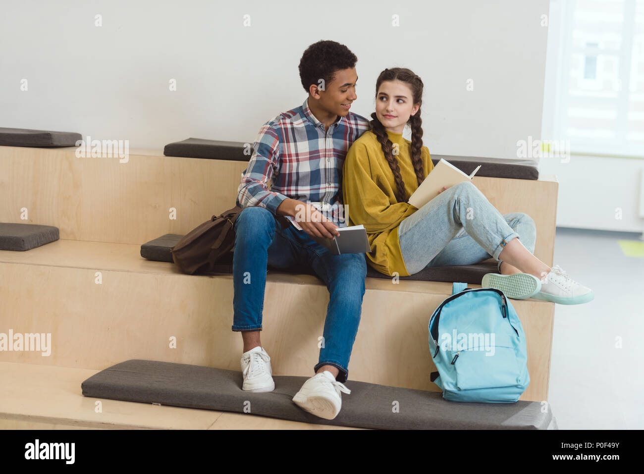 high school students couple studying together at school corridor Stock ...