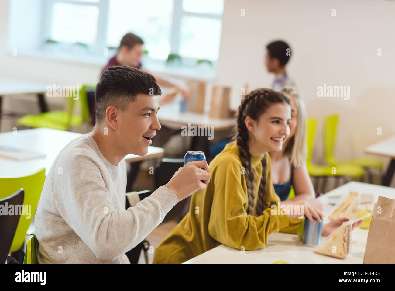 happy group of high school students at school cafeteria Stock Photo - Alamy