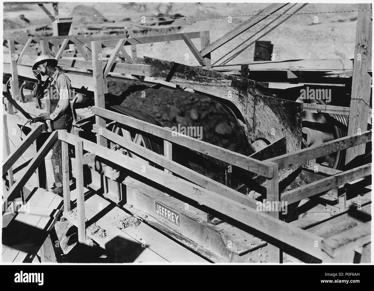 Transfer point on belt conveyor system Stock Photo - Alamy