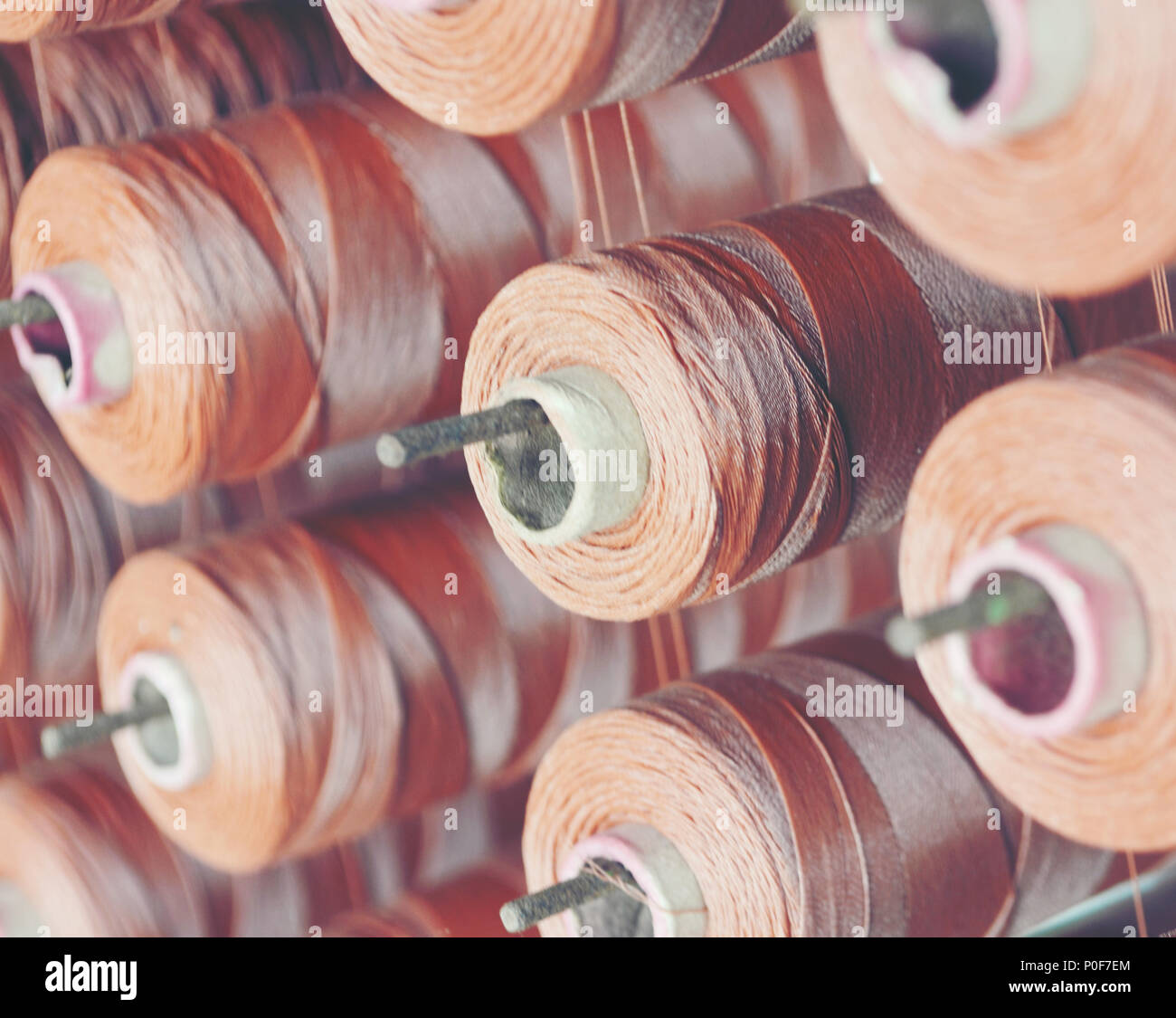 Brown yarn cone mounted in a fabrics factory Stock Photo - Alamy