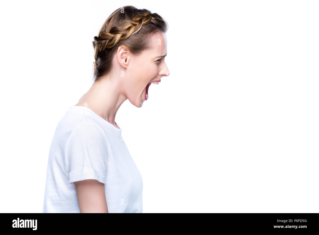 portrait of beautiful yelling woman in white t-shirt, isolated on white ...