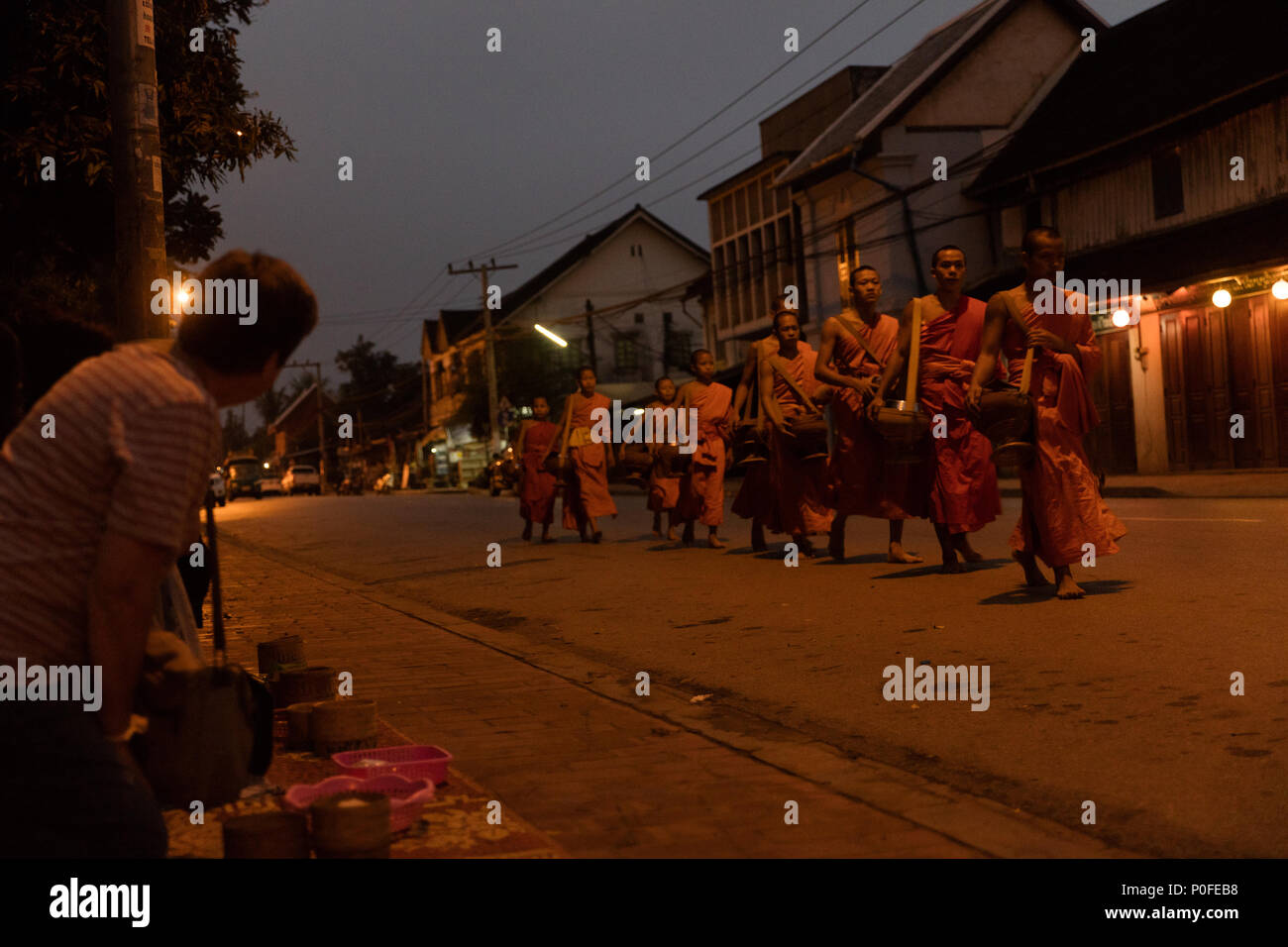 Feeding the monks. The ritual is called Tak Bat, Luang Prabang, Laos ...