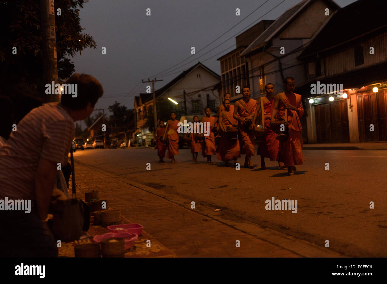 Feeding the monks. The ritual is called Tak Bat, Luang Prabang, Laos ...