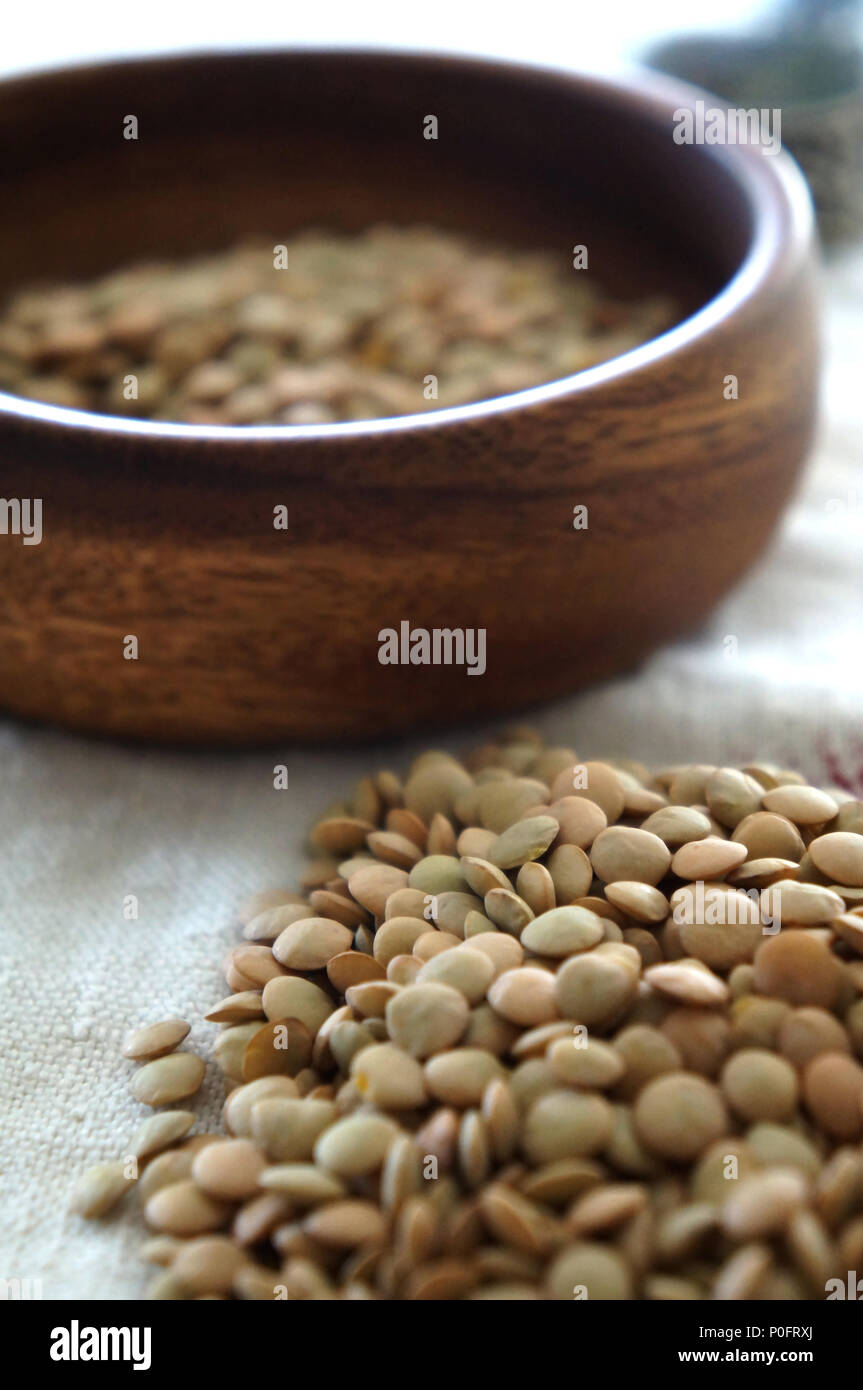 raw lentils in wood bowl Stock Photo - Alamy