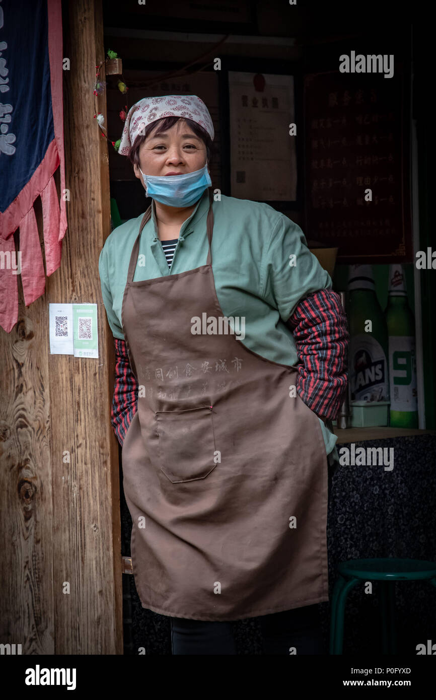 Female shopkeeper china hi-res stock photography and images - Alamy