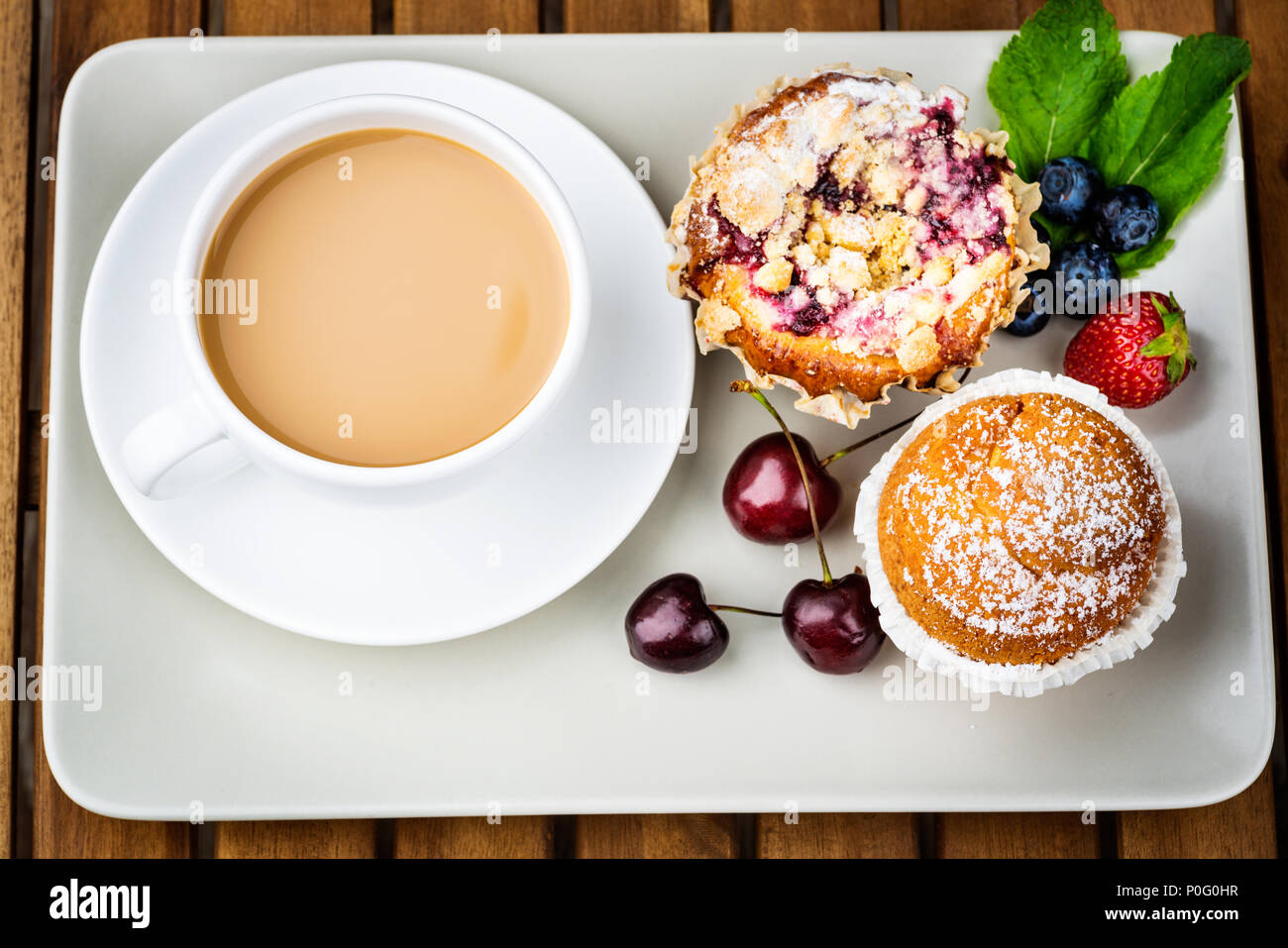 Cup of coffee and pastry on wooden background Stock Photo - Alamy